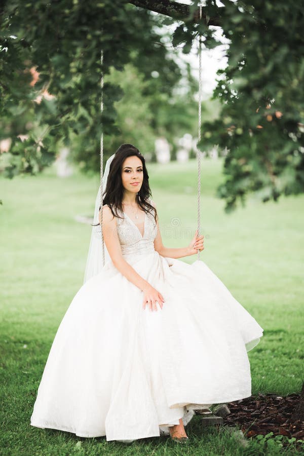 Beautiful Bride Posing in Wedding Dress Outdoors Stock Photo - Image of ...