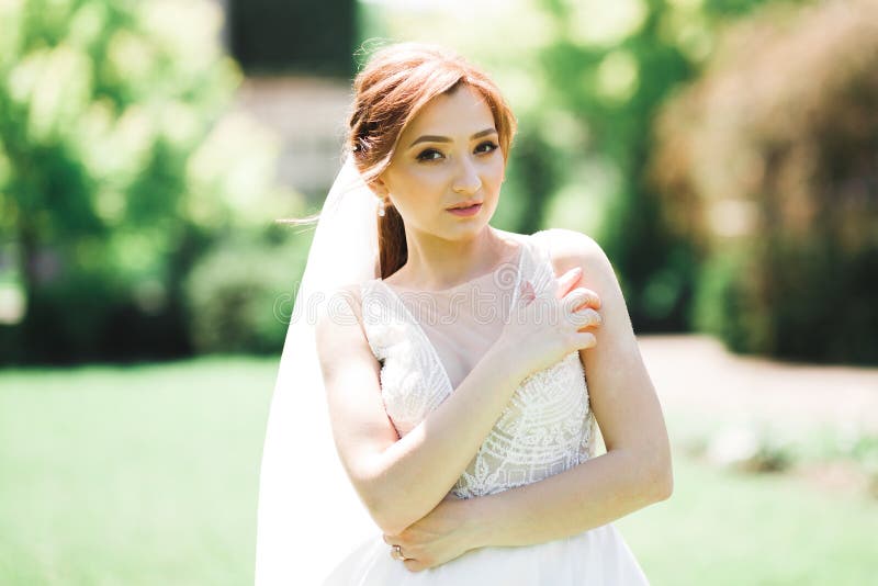 Beautiful Bride Posing in Wedding Dress Outdoors Stock Image - Image of ...
