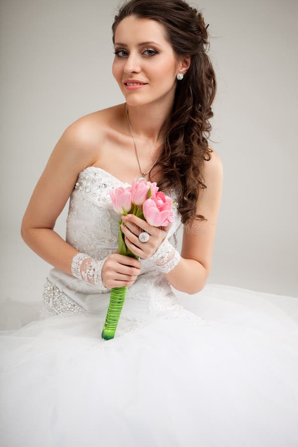 Beautiful Bride Sitting on the Floor Stock Photo - Image of dress ...