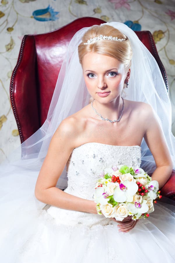 Beautiful Bride Sitting in Red Armchair Stock Photo - Image of holiday ...