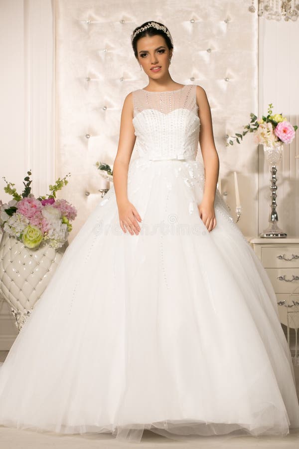 Beautiful Bride in Wedding Dress Stock Photo - Image of couch, looking ...