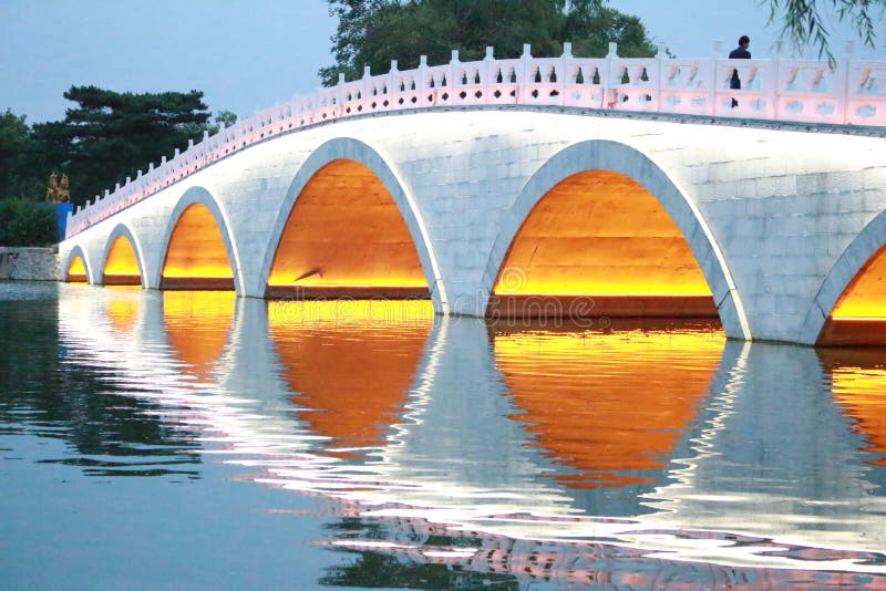 A Beautiful Bridge at Nightfall Stock Photo - Image of place, lively ...