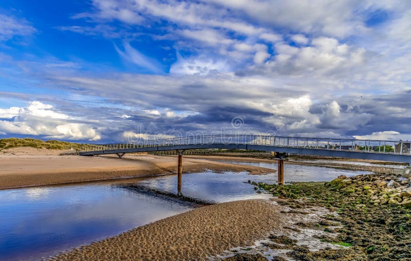 Beautiful Bridge Over the River with a Cloudy Blue Sky in the ...
