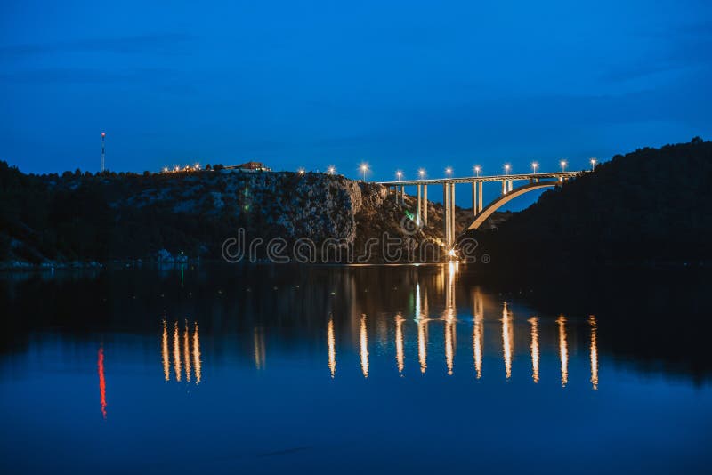 Beautiful Bridge Reflected in the Water at Night Stock Image - Image of ...
