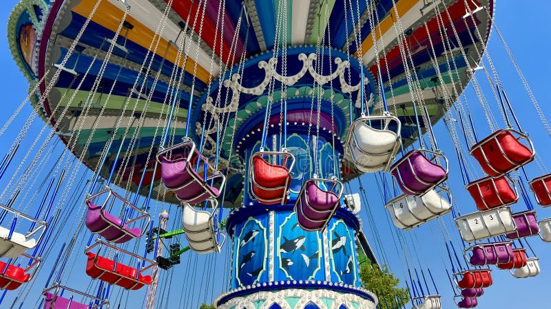 Beautiful Bright Swing Chain on Which Empty Seats Spin Preparing ...