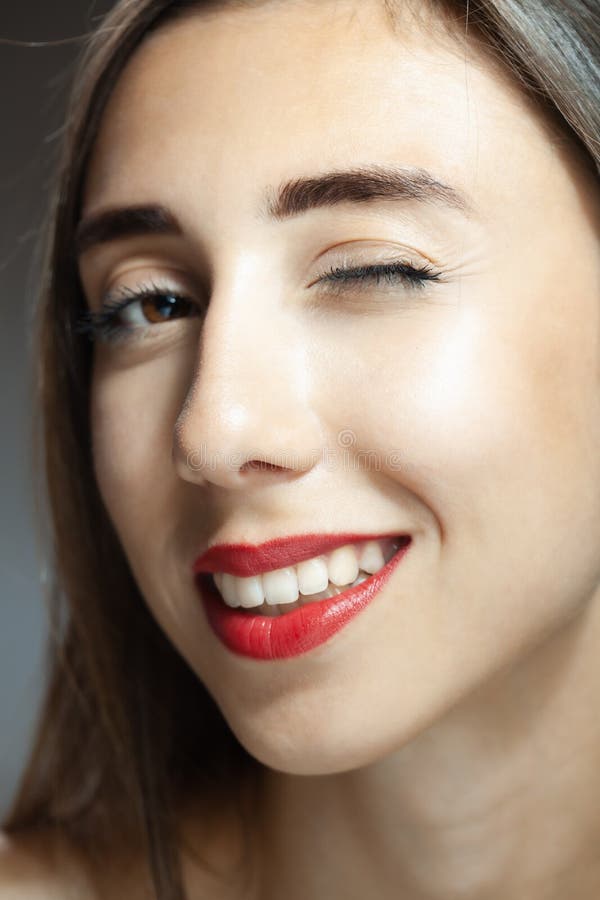 Beautiful Brunette Girl Studio Portrait. Winking and Smiling Face ...