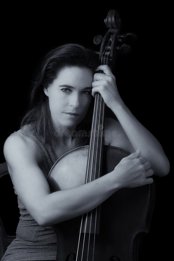 Beautiful Brunette Holding Cello with Selective Light in Red Dress ...