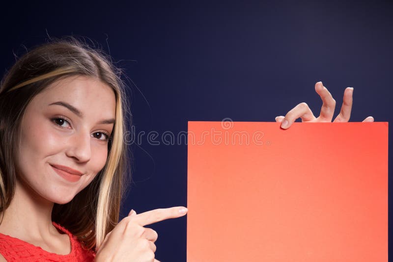 Beautiful Brunette Holds a Colored Blank Page. Stock Image - Image of ...