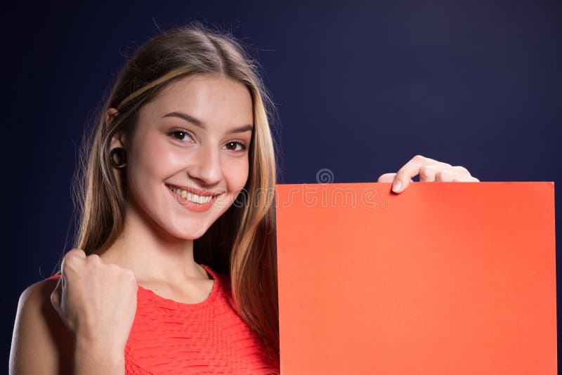 Beautiful Brunette Holds a Colored Blank Page. Stock Photo - Image of ...