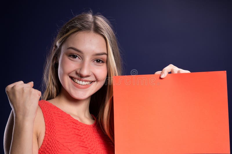 Beautiful Brunette Holds a Colored Blank Page. Stock Image - Image of ...