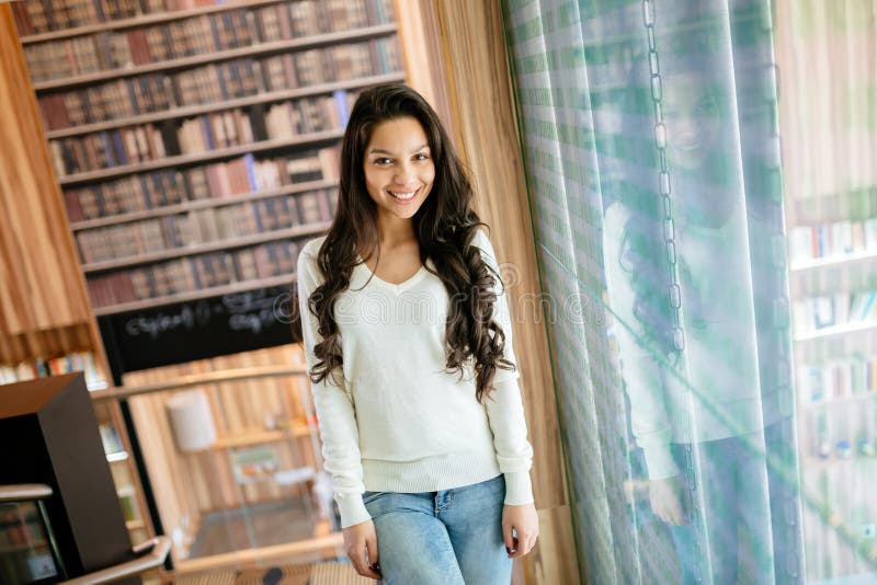 Beautiful Brunette in Library Stock Image - Image of brunette, indoors ...