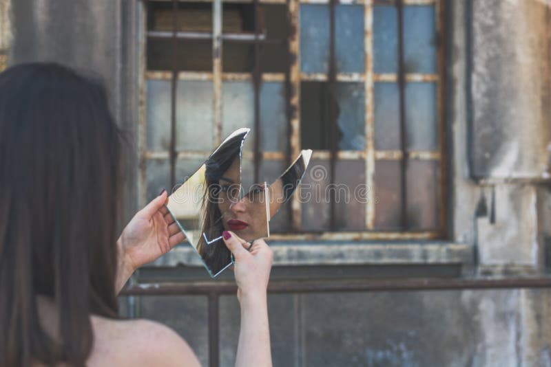 Beautiful Brunette Looking at Herself in a Mirror Stock Image - Image ...