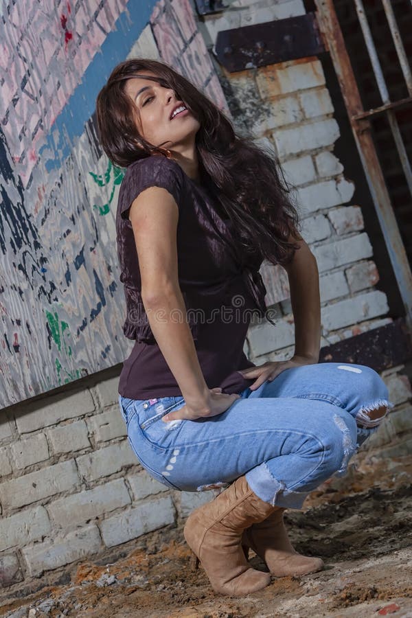 A Lovely Brunette Model Posing Outdoors With The Latest Fashions Stock