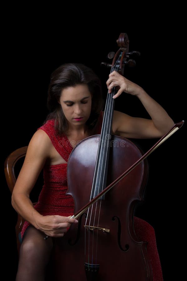Beautiful Brunette Playing Cello with Selective Light in Red Dress ...