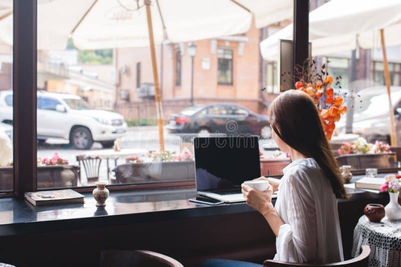 Beautiful Brunette Using Laptop in Cafe. Coffee, Stock Image - Image of ...