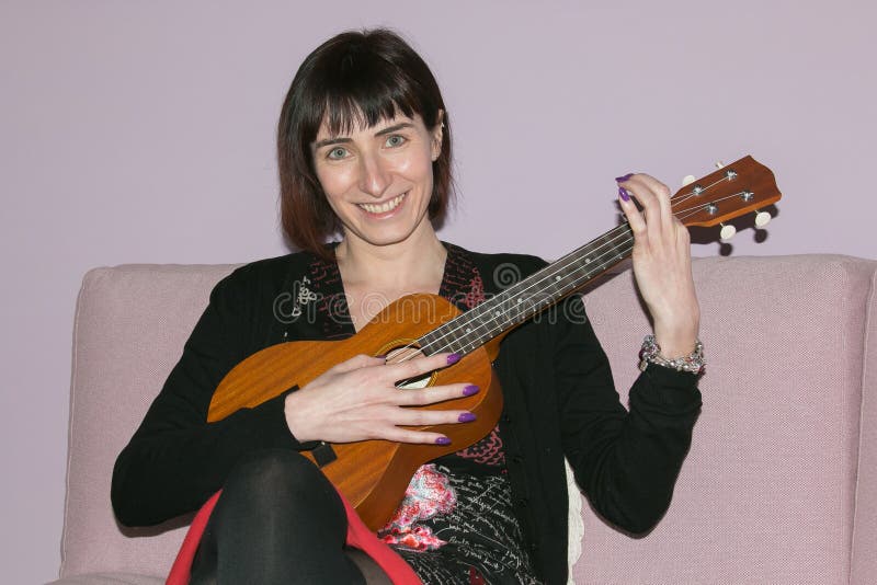Beautiful Brunette Woman Playing Ukulele Stock Image - Image of jazz ...