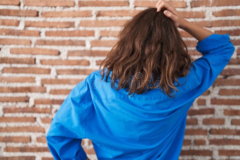 Beautiful Brunette Woman Standing Over Bricks Wall Backwards Thinking ...