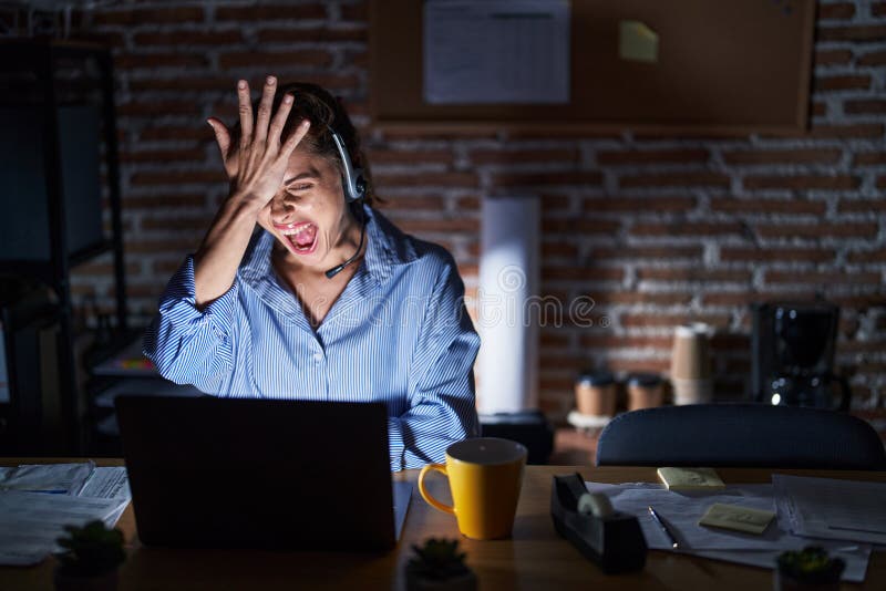 Beautiful Brunette Woman Working at the Office at Night Surprised with ...