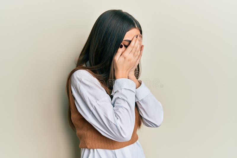 Beautiful Brunette Young Woman Wearing Casual Clothes With Sad