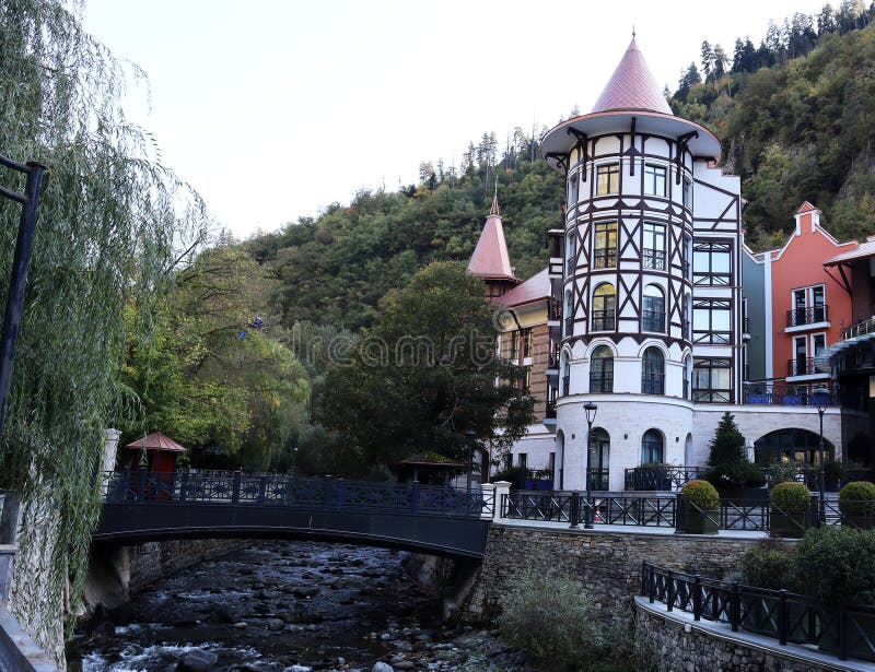 A Beautiful Building with a Conical Crown, a Bridge and a River Stock ...