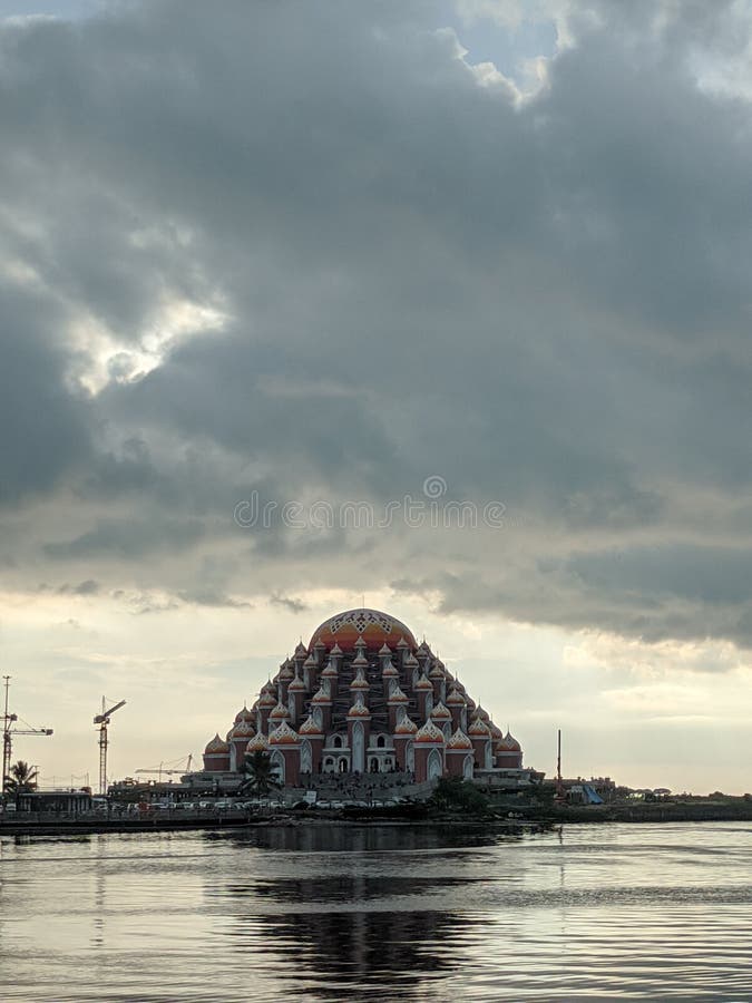 The Beautiful Building in the Middle Sea, with the Perfect Cloud Stock ...