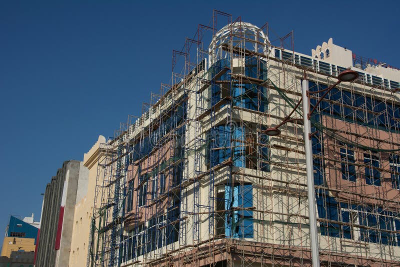 Beautiful Building Under Construction is Encased in Scaffolding ...