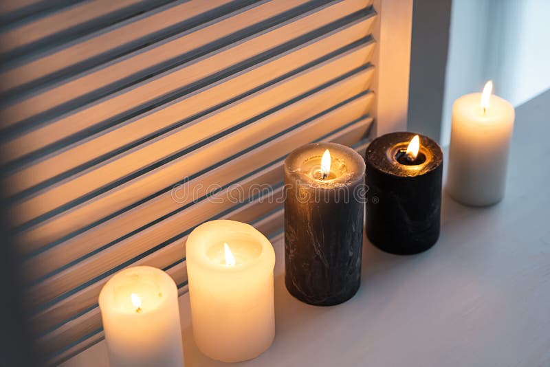 Beautiful Burning Candles on Windowsill Stock Photo - Image of black ...