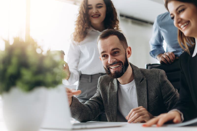 Beautiful Business People are Using Computers and Smiling while Working ...