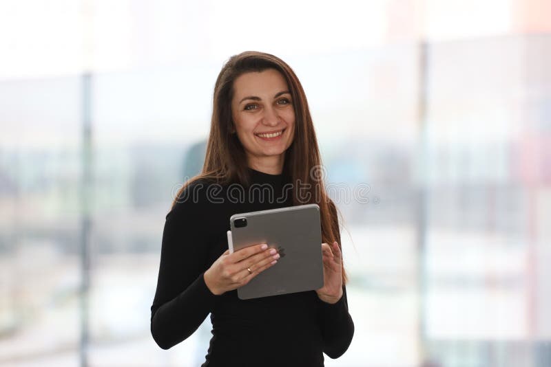 Beautiful Business Woman Using Tablet Computer Texting while Walking in ...