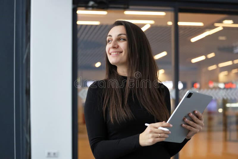 Beautiful Business Woman Using Tablet Computer Texting while Walking in ...