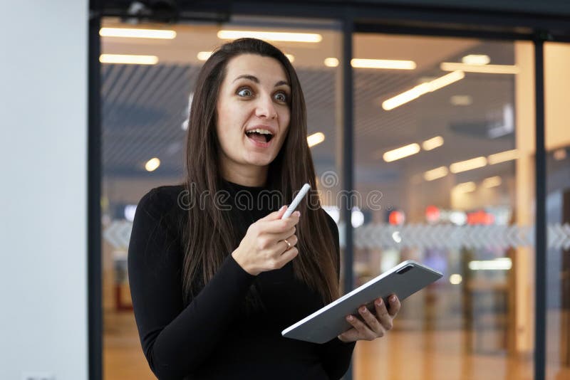 Beautiful Business Woman Using Tablet Computer Texting while Walking in ...