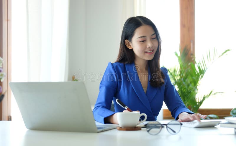 Beautiful Businesswoman Working with Laptop Computer and Using ...
