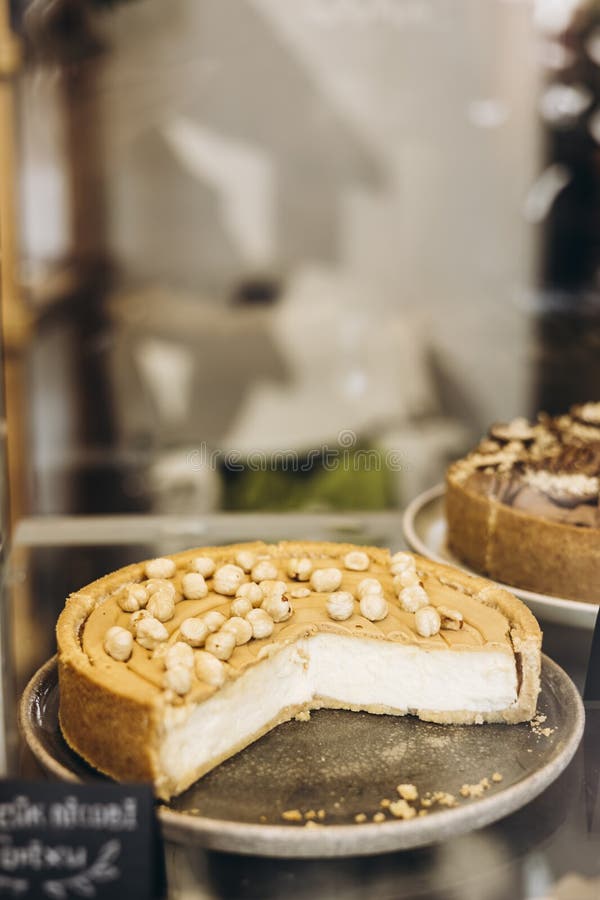 A Beautiful Cake Decorated with Hazelnuts on a Pastry Shop Window ...