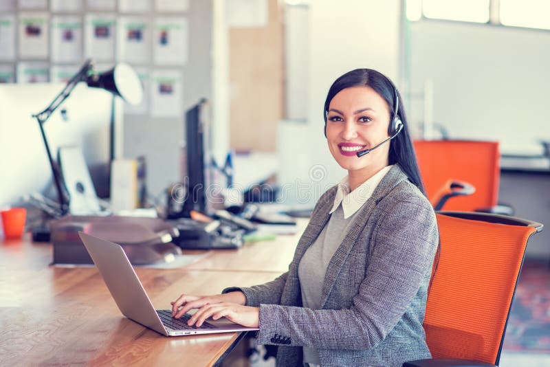 Beautiful Call Center Agent Browsing the Internet on Her Computer Stock ...