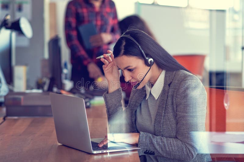 Beautiful Call Center Agent Browsing the Internet on Her Computer Stock ...