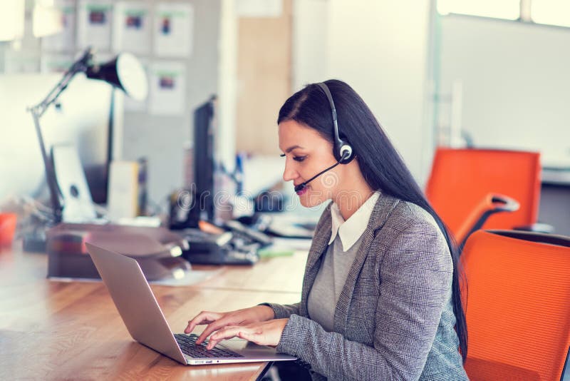 Beautiful Call Center Agent Browsing the Internet on Her Computer Stock ...