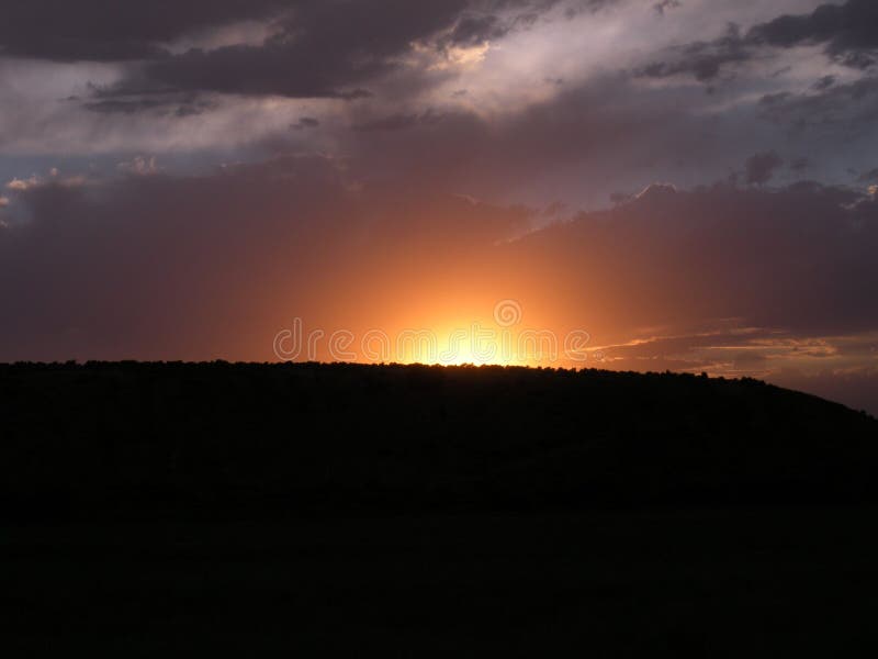 Beautiful Calm Sunset Over the Silhouette of a Hill Stock Image - Image ...