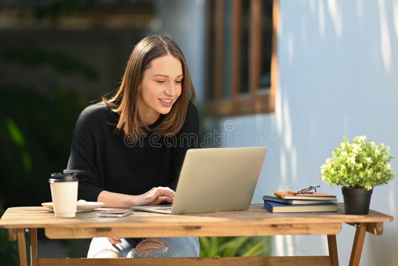Beautiful Caucasian Woman Having Remote Work on Laptop Computer while ...