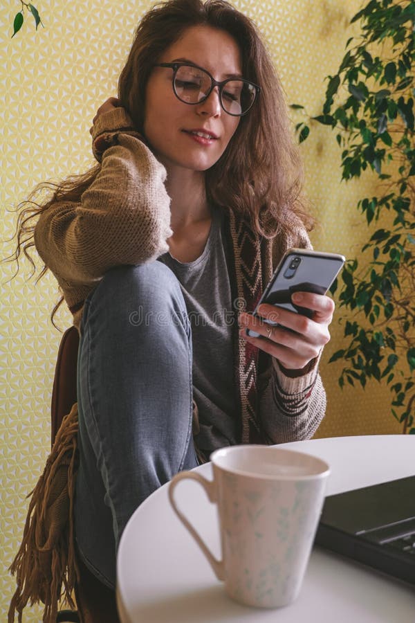 Caucasian Woman Using Mobile Phone and Sitting at the Table Stock Image ...