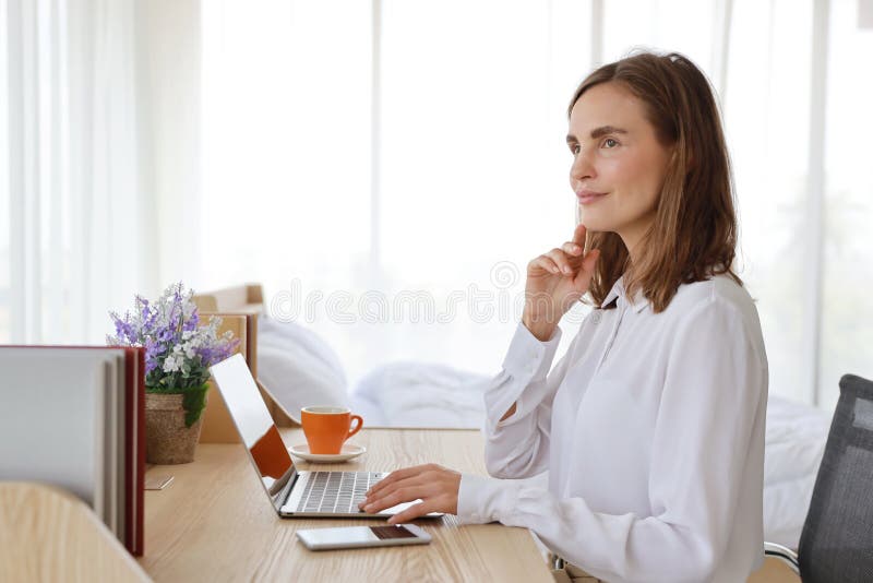 Beautiful Caucasian Working on Laptop Computer while Thinking Something ...