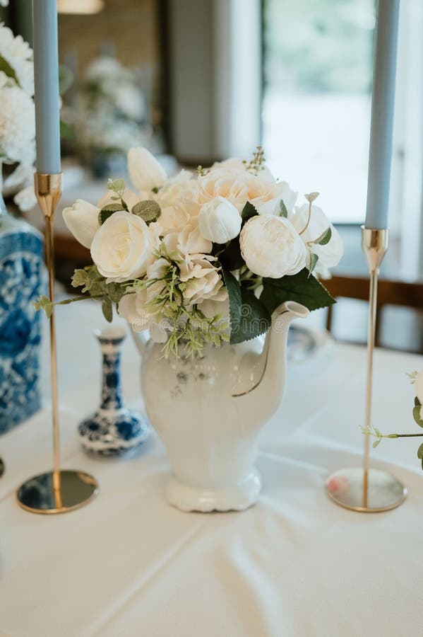 Beautiful Centerpiece for a Wedding Table with a Teapot with Flowers ...
