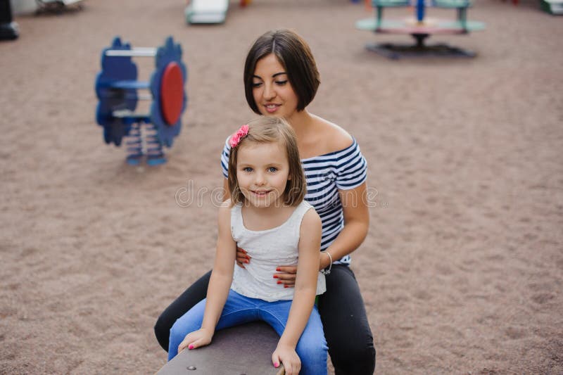 Beautiful , Cheerful Mother and Daughter on Swing Stock Photo - Image ... Beautiful , Cheerful Mother and Daughter on Swing Stock Photo - Image ...