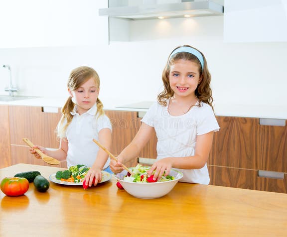 Beautiful Chef Sisters at Kitchen Preparing Salad Stock Photo - Image ...