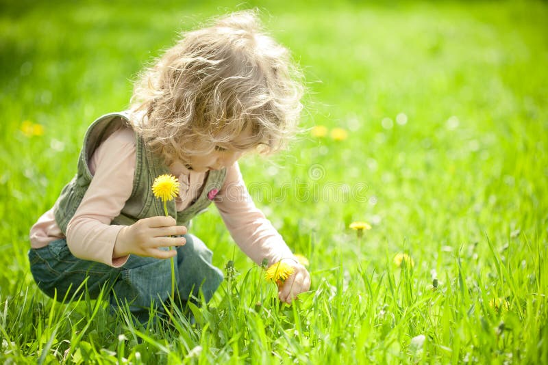 Child Touching Spring Flower Stock Photo - Image of earth, outside ...
