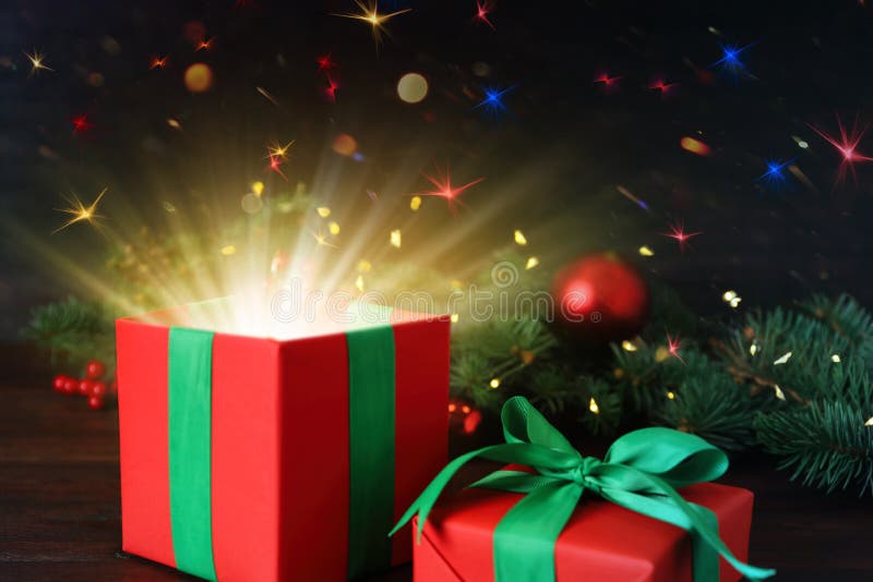 Beautiful Christmas Gift Box with Magic Light on Table Stock Image ...