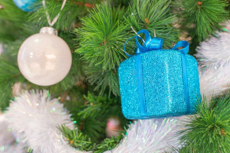 Christmas Gift Boxes Hanging from a Decorated Christmas Tree Stock ...