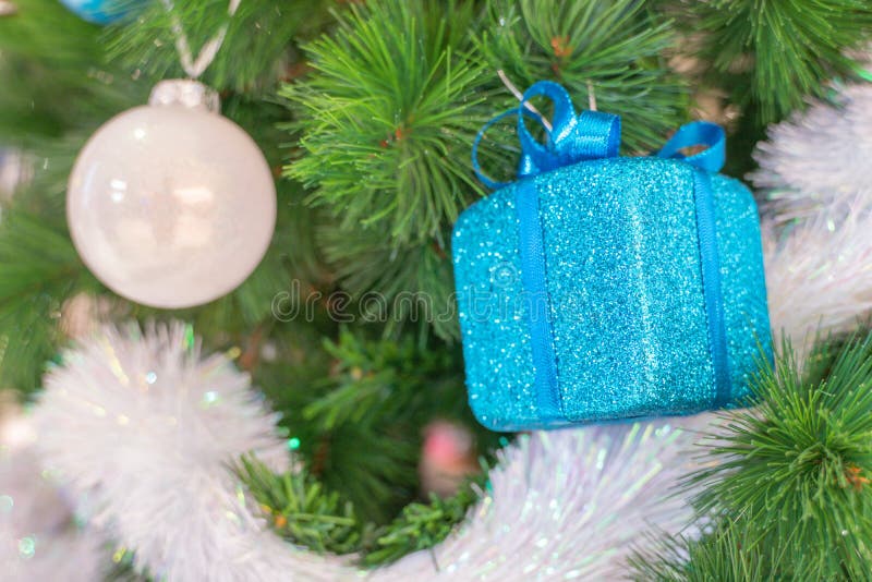 Christmas Gift Boxes Hanging from a Decorated Christmas Tree Stock ...