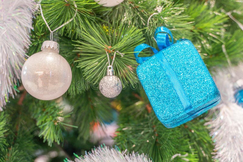 Christmas Gift Boxes Hanging from a Decorated Christmas Tree Stock ...