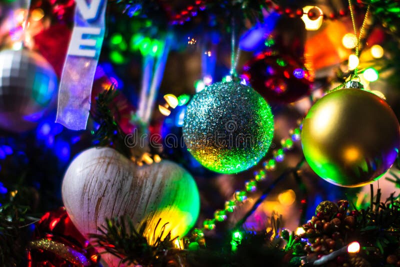 Beautiful Christmas Ornaments and Lights Hanging in the Christmas Tree ...