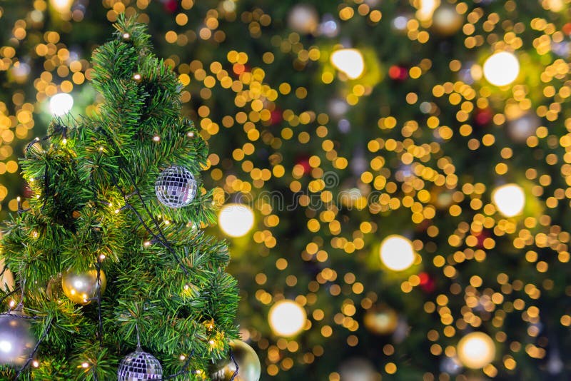 Beautiful Christmas Tree with Decor Against Blurred Bokeh Lights in ...